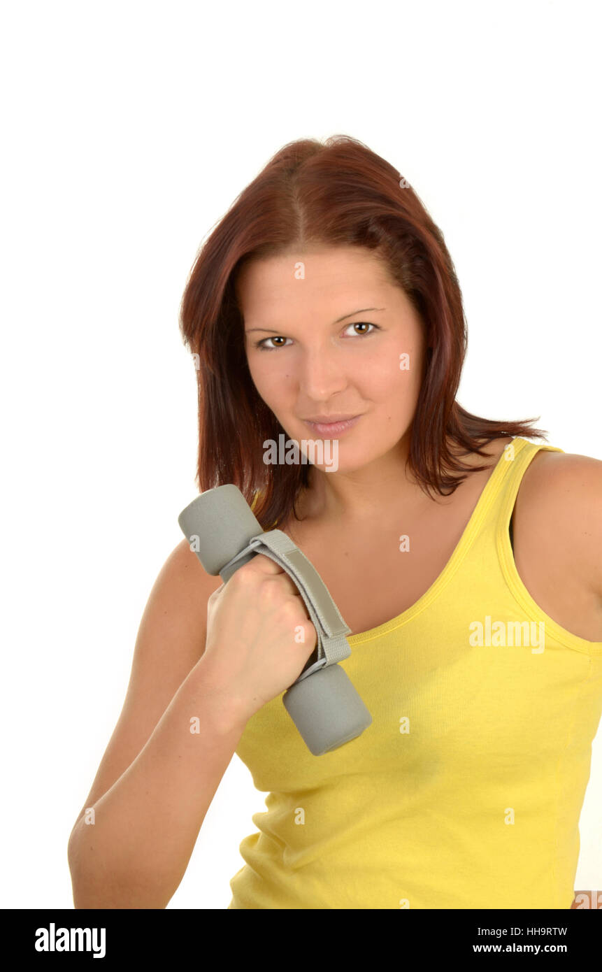 Young woman in a yellow tank top against white background during power ...