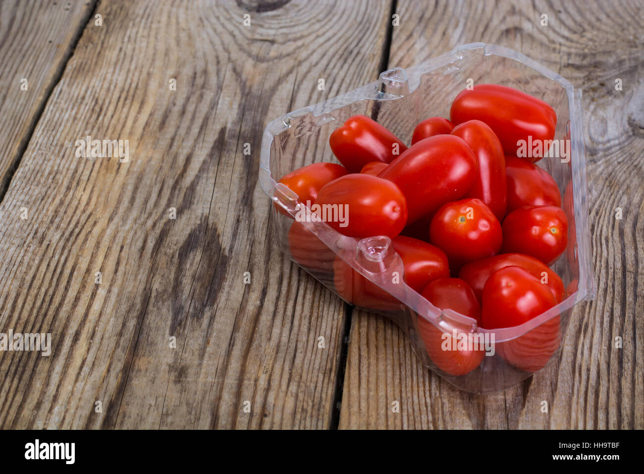Small red oblong tomatoes Stock Photo - Alamy