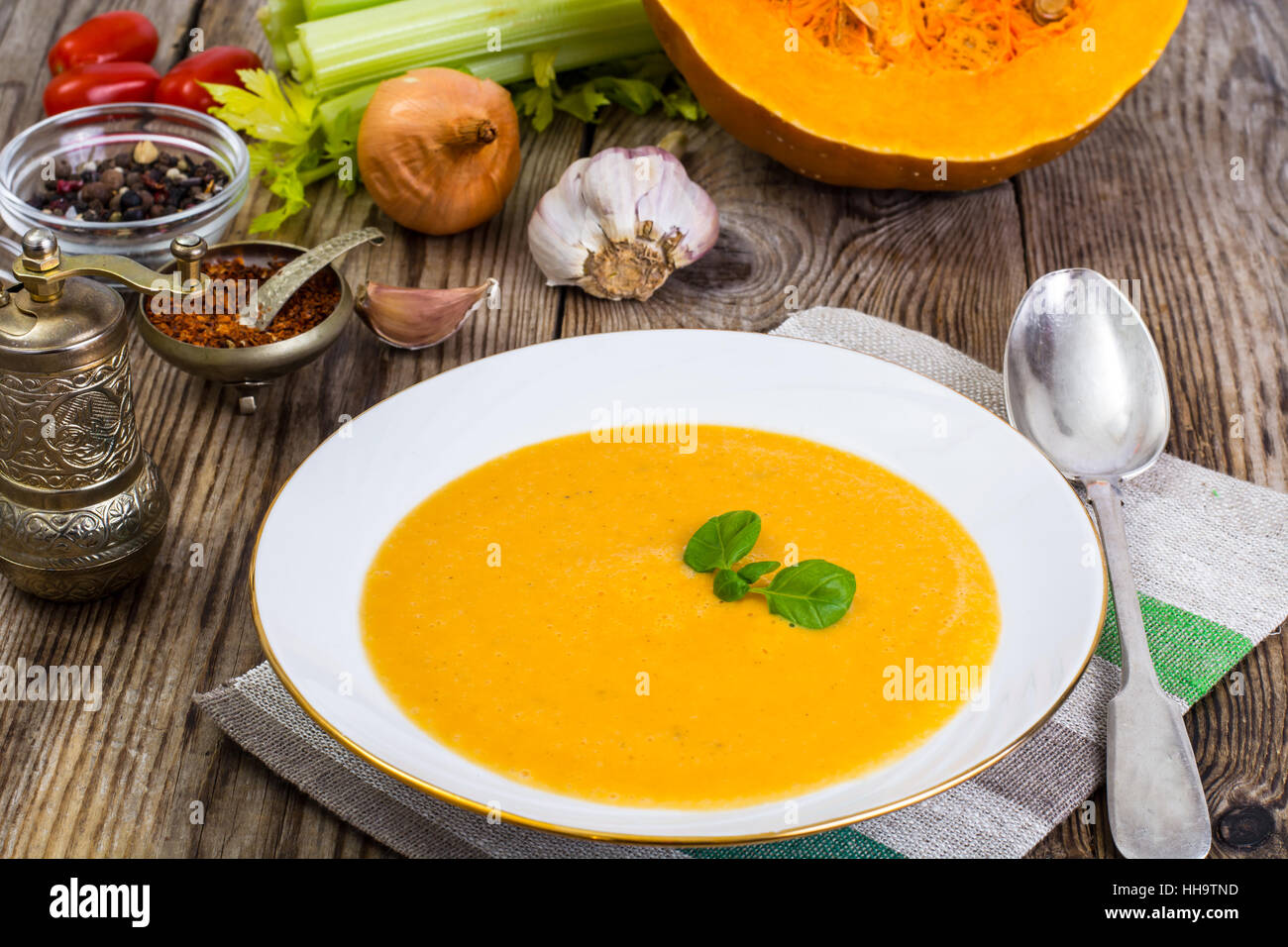 Vegetable cream soup with celery, pumpkin, basil Stock Photo - Alamy