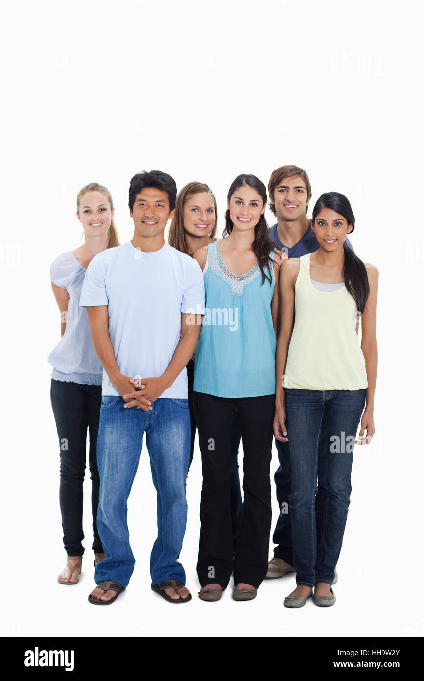 People smiling together against white background Stock Photo - Alamy