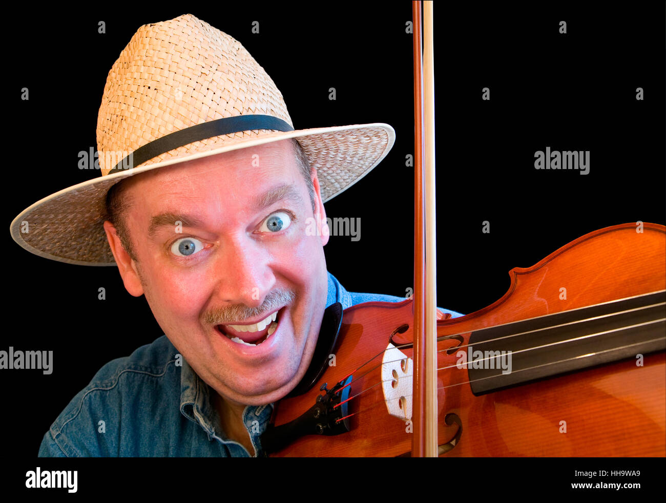 A man is playing country music on the fiddle Stock Photo - Alamy A man is playing country music on the fiddle Stock Photo - Alamy