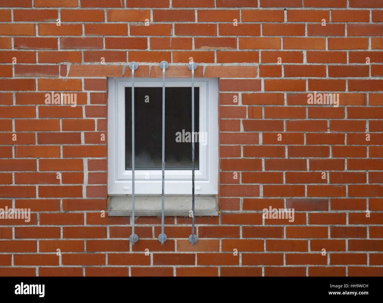 architectural detail of a barred window in a red brick wall Stock Photo ...