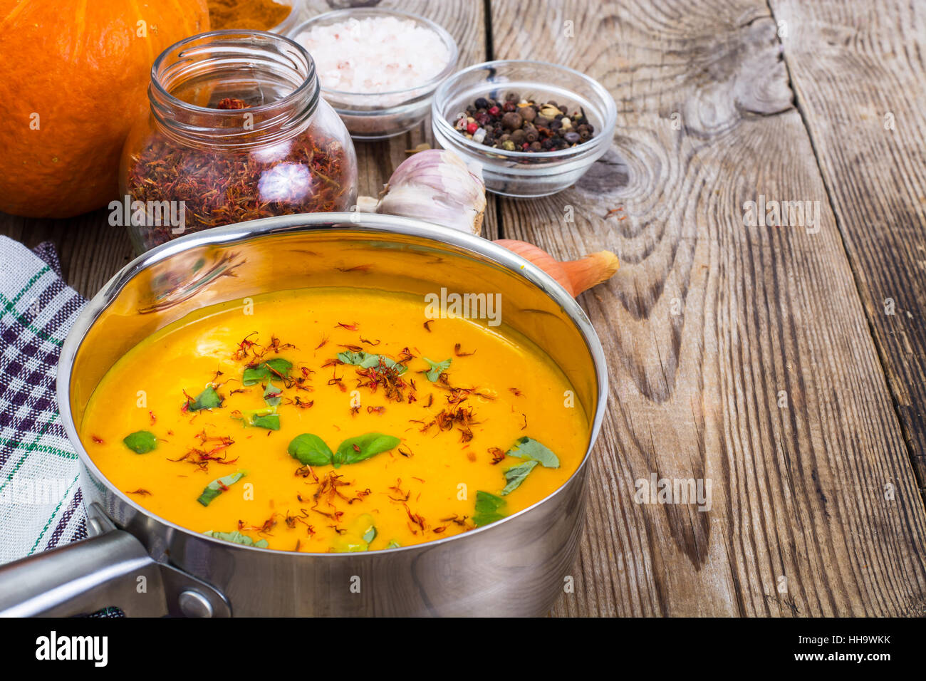 Dishes from pumpkin with saffron and basil Stock Photo - Alamy