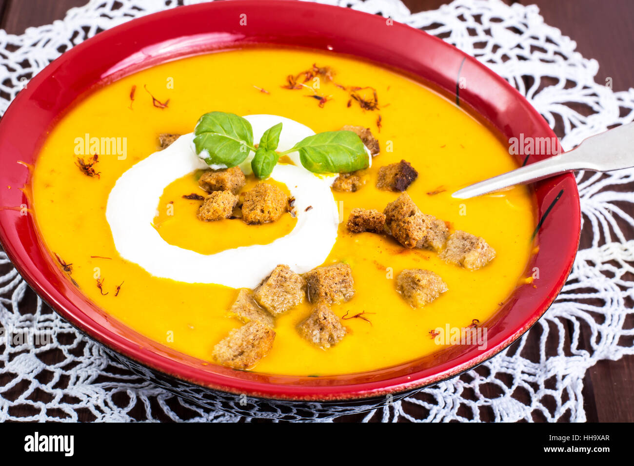 Spiced carrot puree with croutons Stock Photo - Alamy