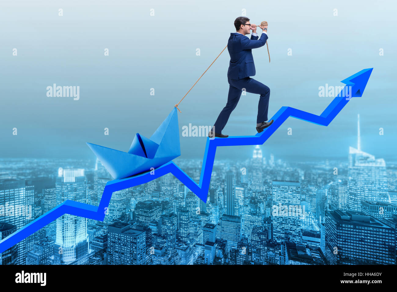 Businessman pulling boat over line chart Stock Photo - Alamy