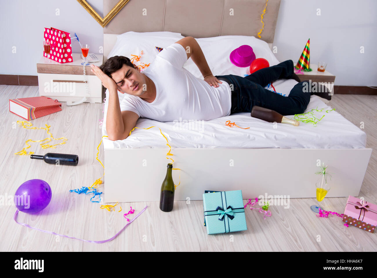 Man at home after heavy partying Stock Photo - Alamy