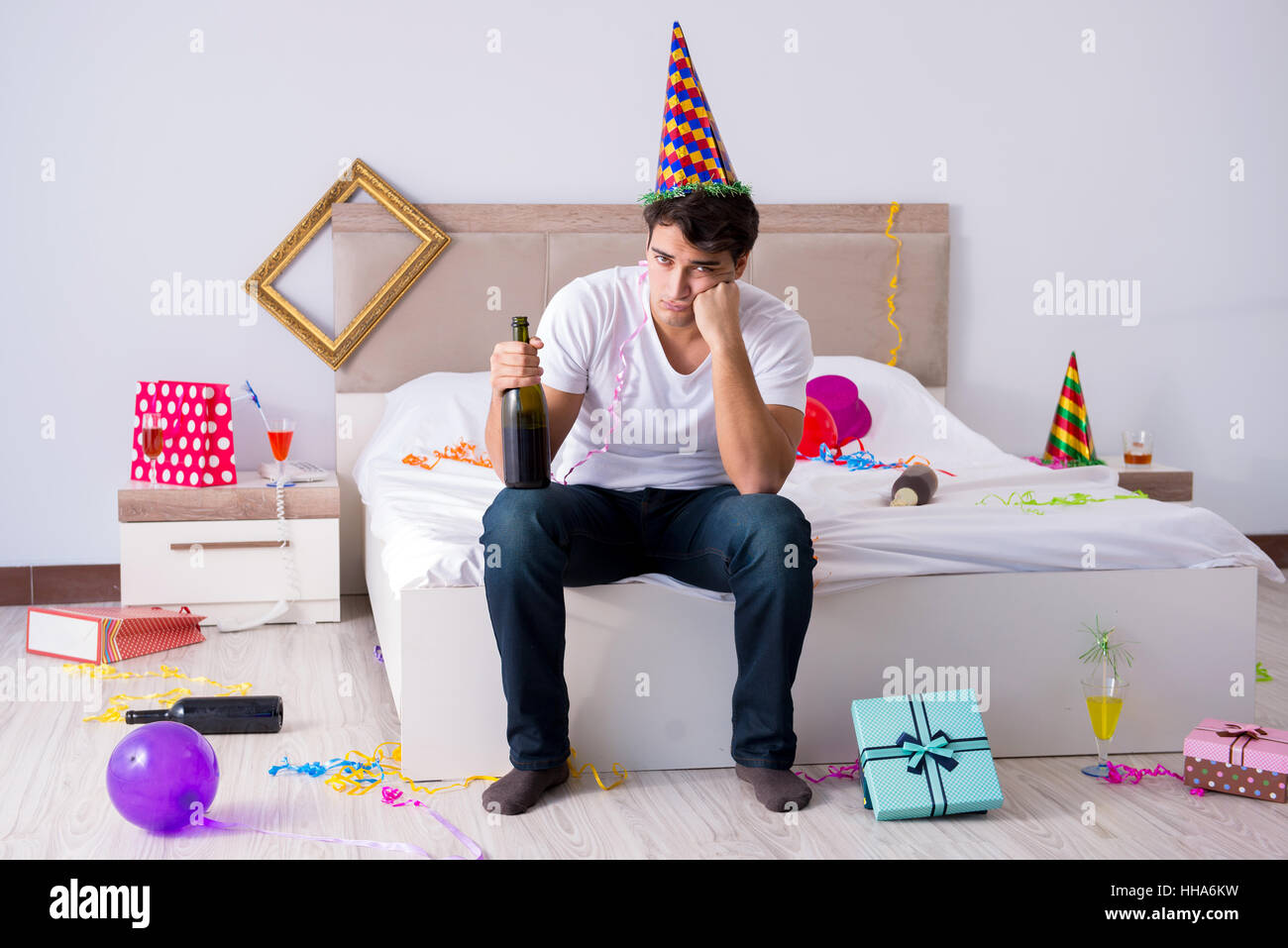 Man at home after heavy partying Stock Photo - Alamy