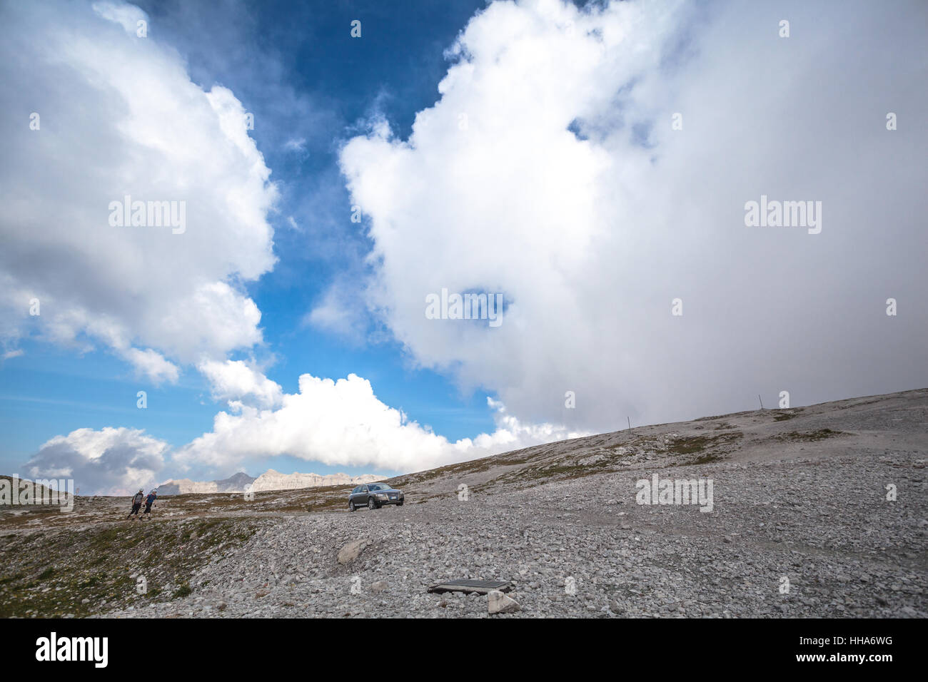 Car and people on the top of the Italian Alps Stock Photo - Alamy