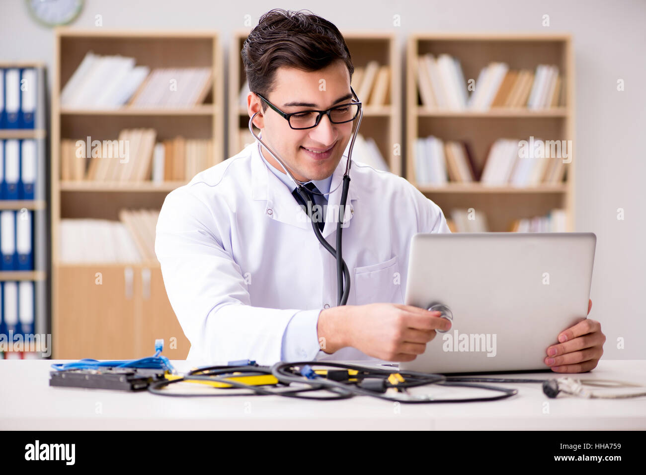 IT technician repairing broken laptop notebook computer Stock Photo - Alamy