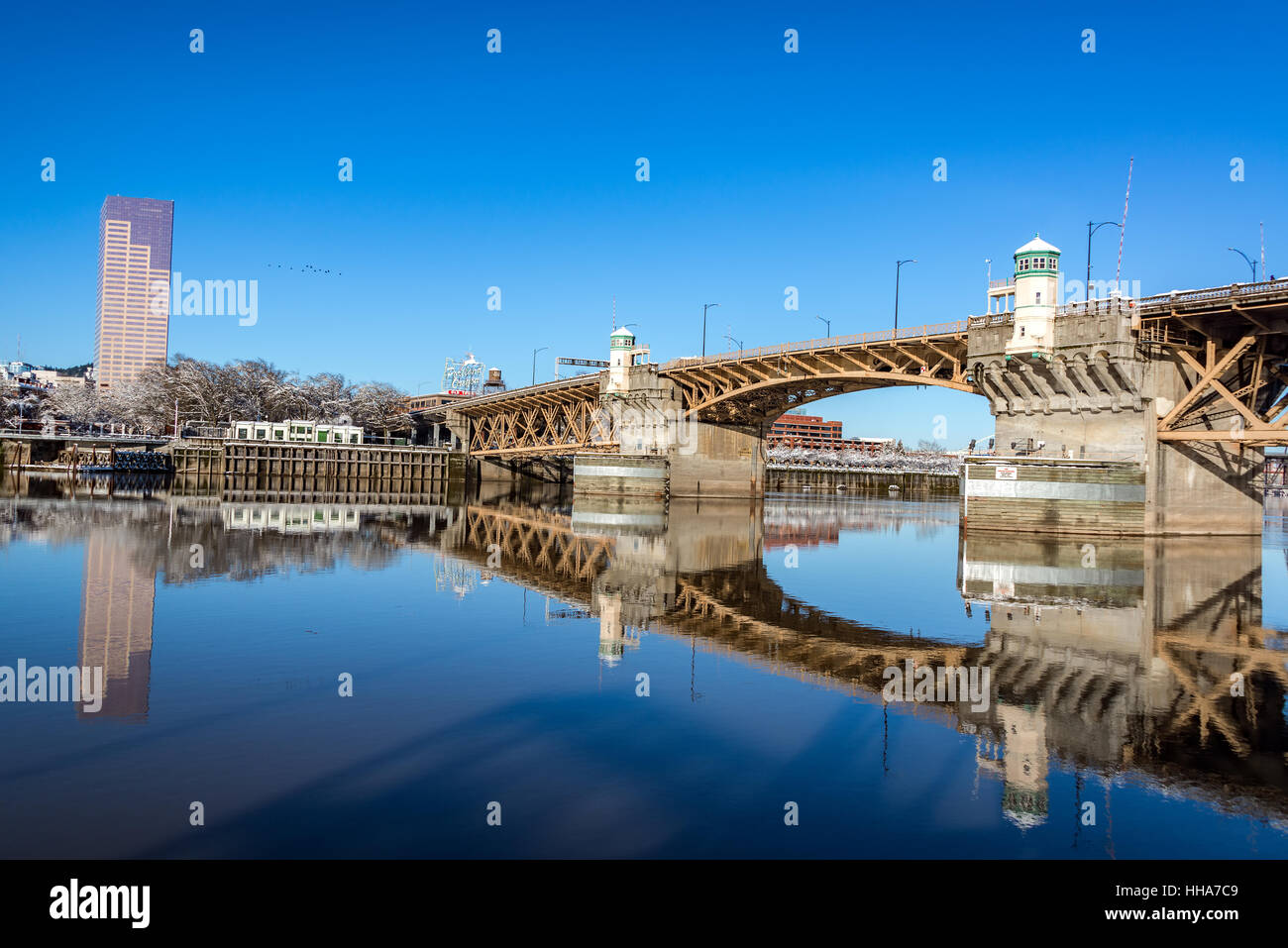 Burnside bridge beautifully reflected in the Willamette River in ...