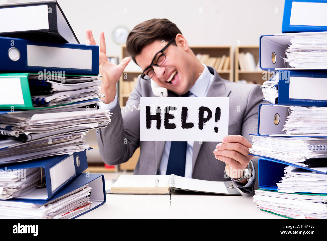 Busy businessman asking for help with work Stock Photo - Alamy