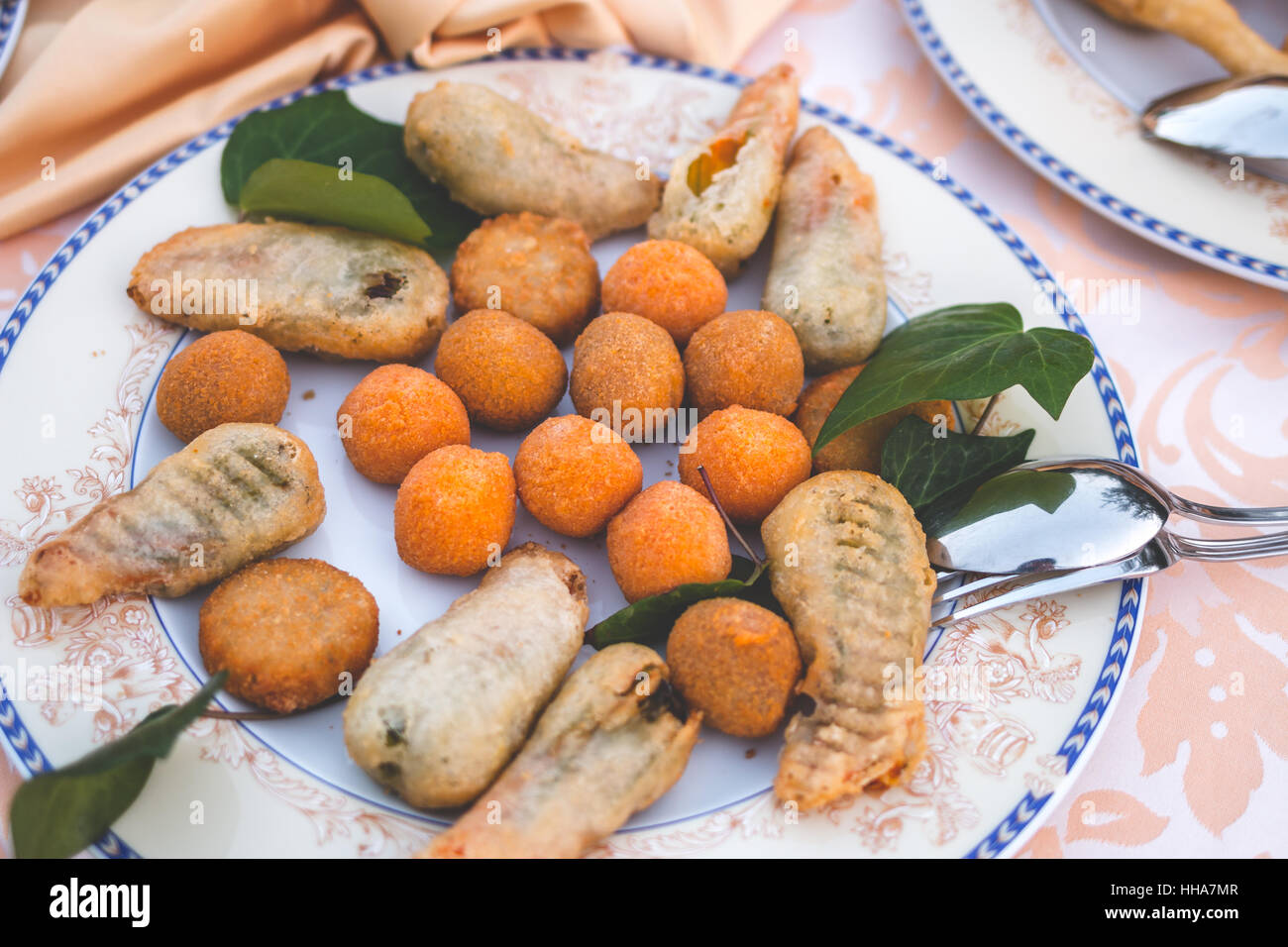 Traditional italian appetizer plate with fried cheese Stock Photo - Alamy