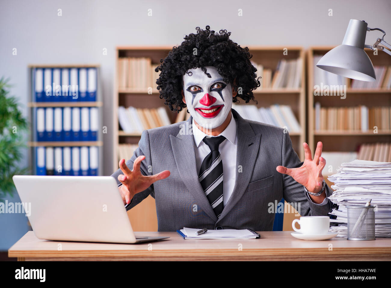 Clown businessman working in the office Stock Photo - Alamy