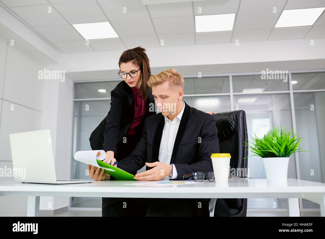 Two businessman working at his desk in the office Stock Photo - Alamy