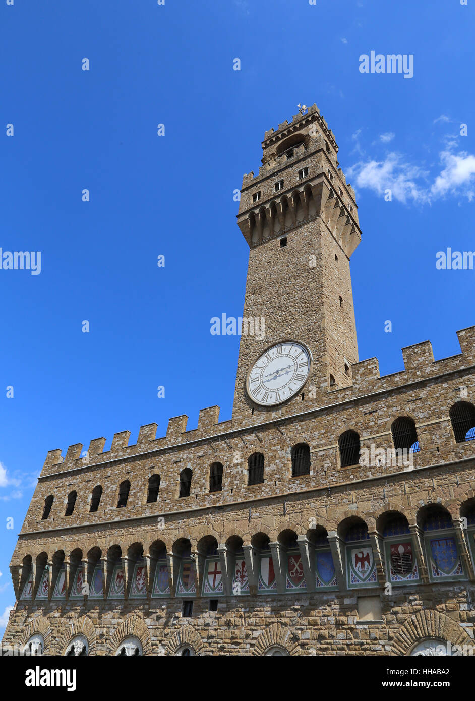 Old Palace called Palazzo Vecchio and clock tower with blue sky in ...