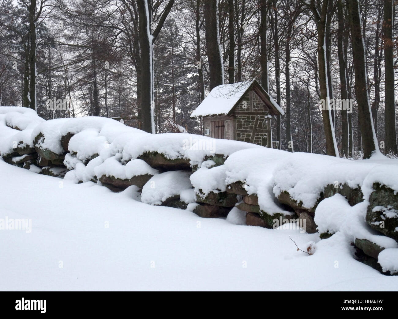 rustic small shack with lots of snow at winter time in Southern Germany ...