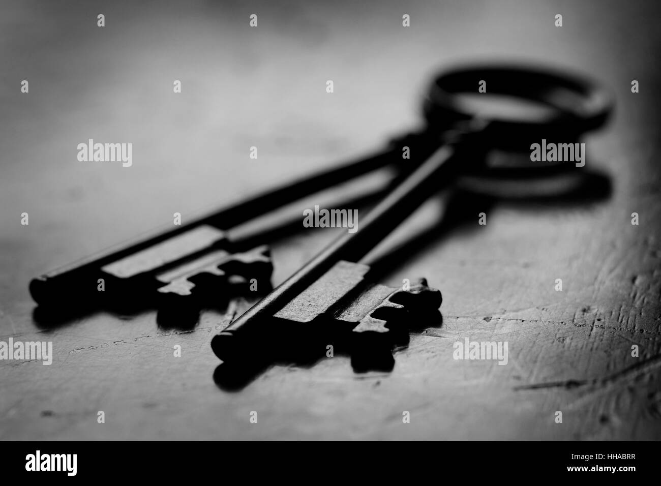 Wooden surface with keys to unlock Stock Photo - Alamy