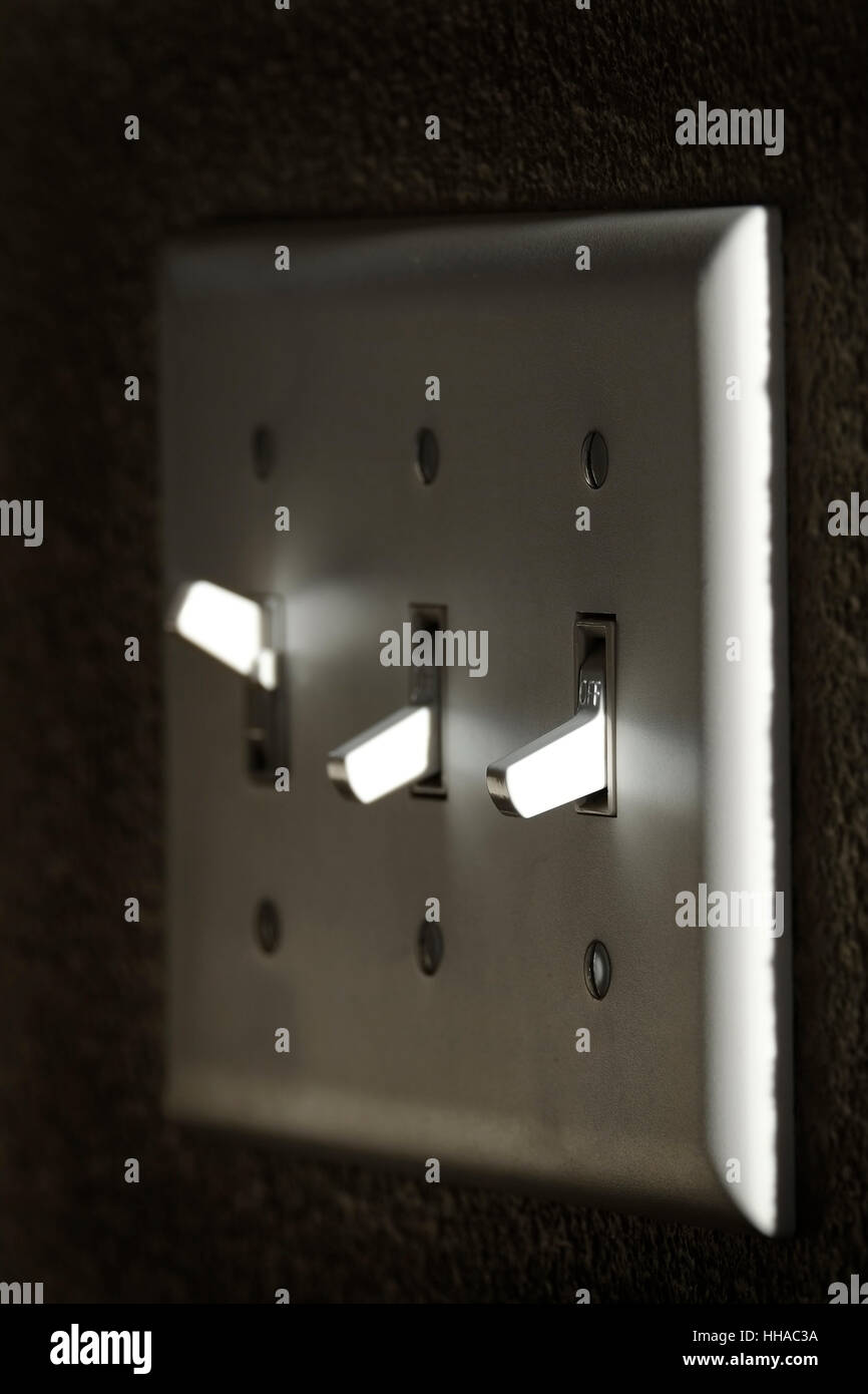 On and off light or power switch on wall with highlights Stock Photo ...