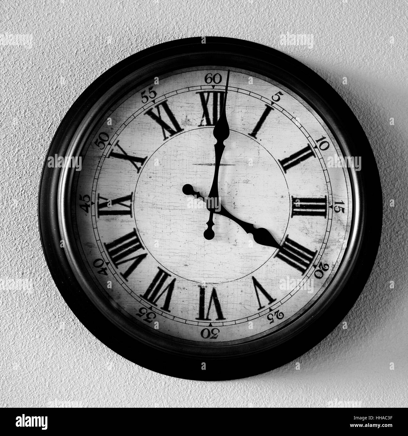 Old vintage clock hanging on wall for time Stock Photo - Alamy