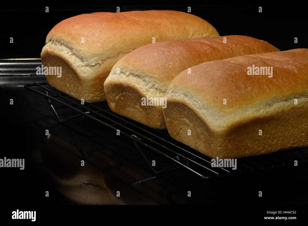 Freshly baked homemade bread on oven cooking on racks Stock Photo - Alamy