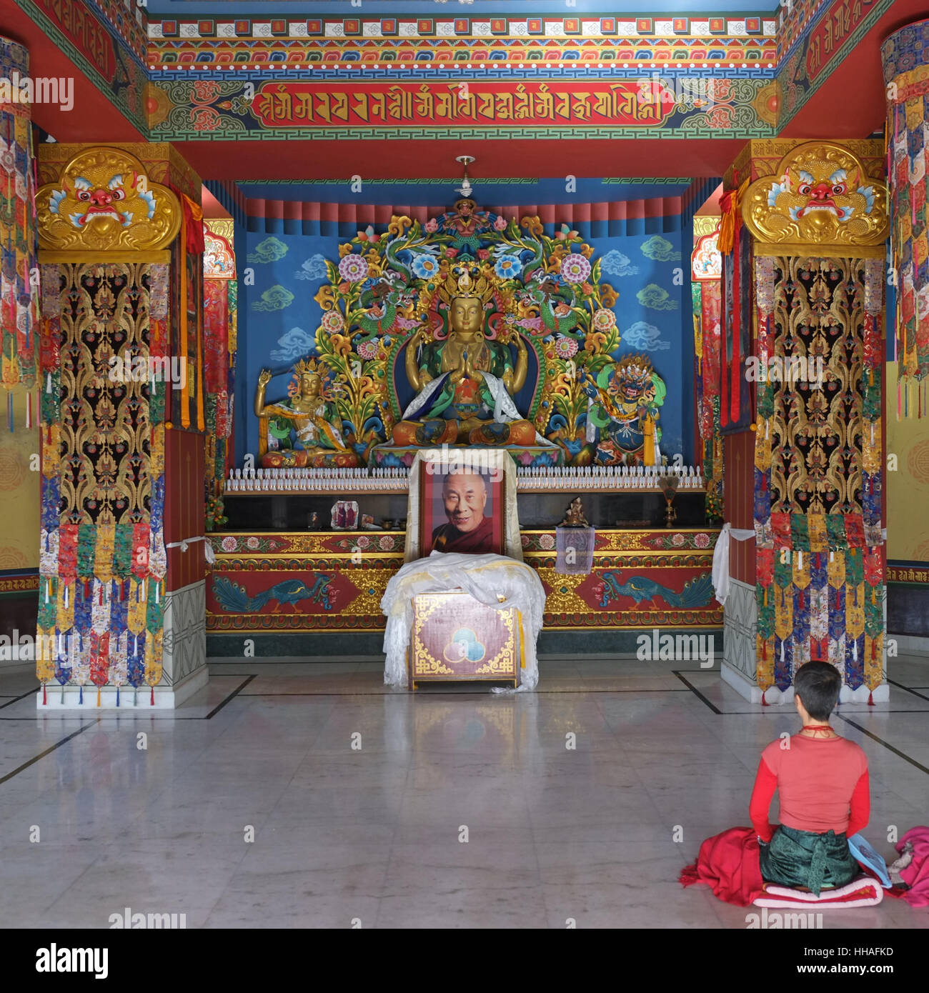 Woman meditating in Rewalsar Lake Monastery Stock Photo - Alamy