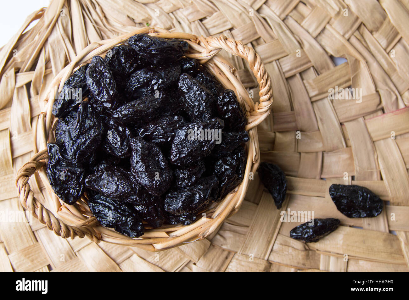 Bunch of dried plum fruits in a bowl Stock Photo - Alamy