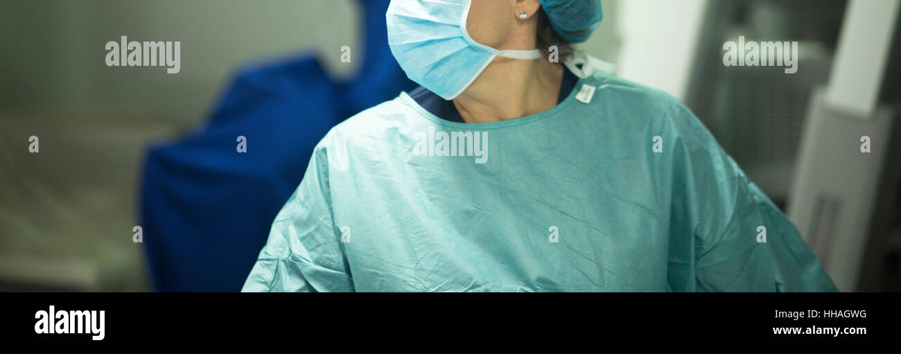 Surgeon in hospital surgery in sterile uniform "scrubs" in operating ...