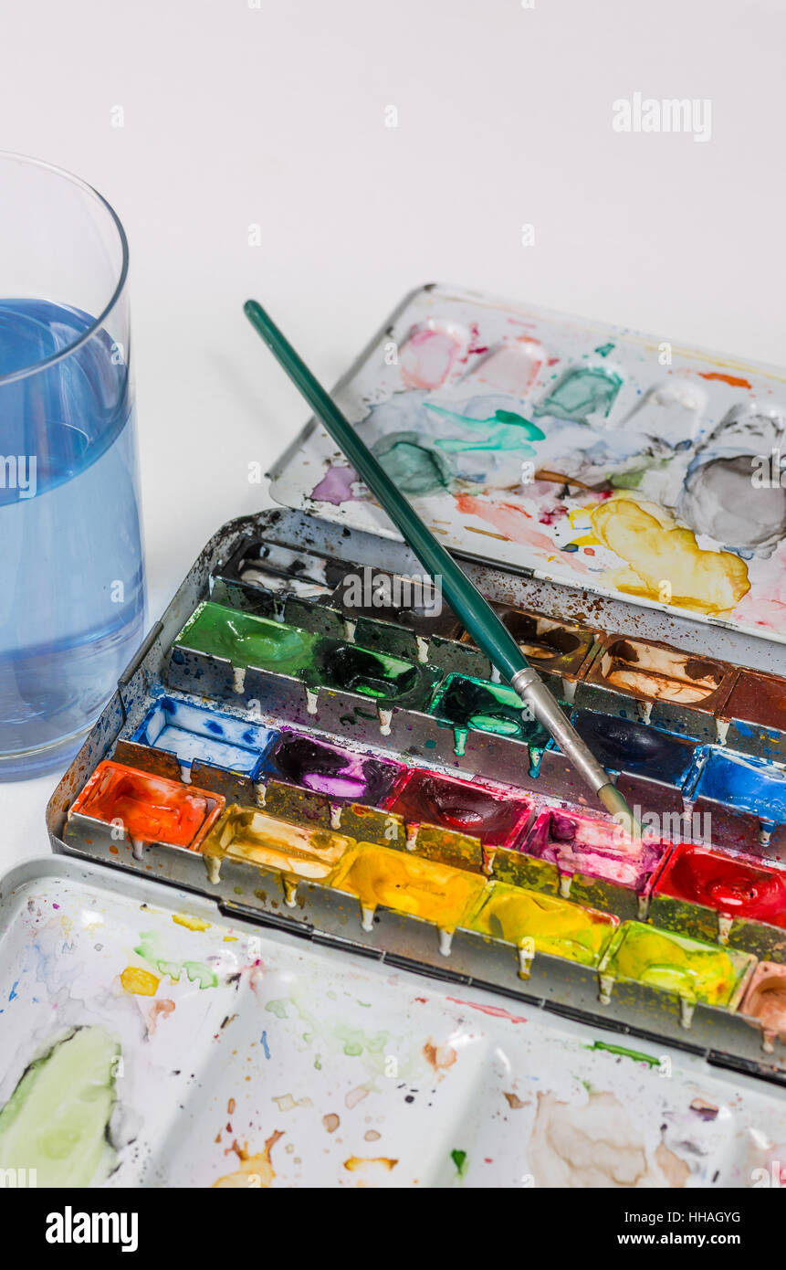watercolor paint box with brush and water glass Stock Photo - Alamy