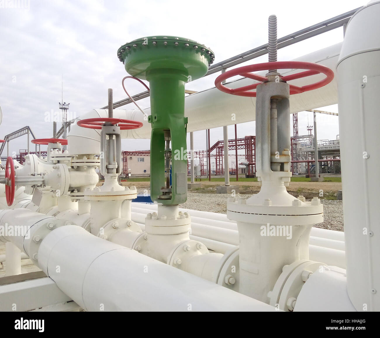 Green pneumatic valve on the pipeline. The equipment of the oil plant ...