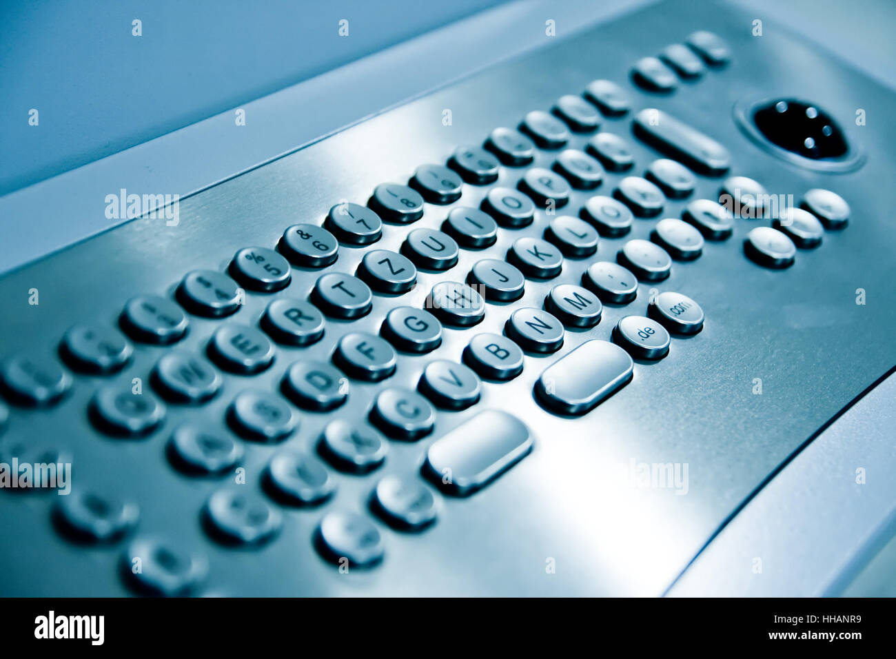 closeup of a public metal terminal keyboard tinted blue Stock Photo - Alamy