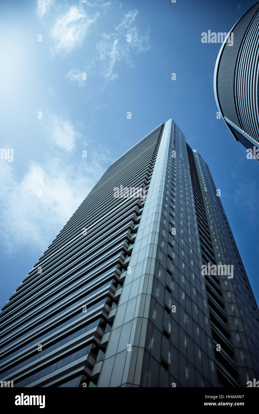 skyscraper view from below with perfect blue sky Stock Photo - Alamy