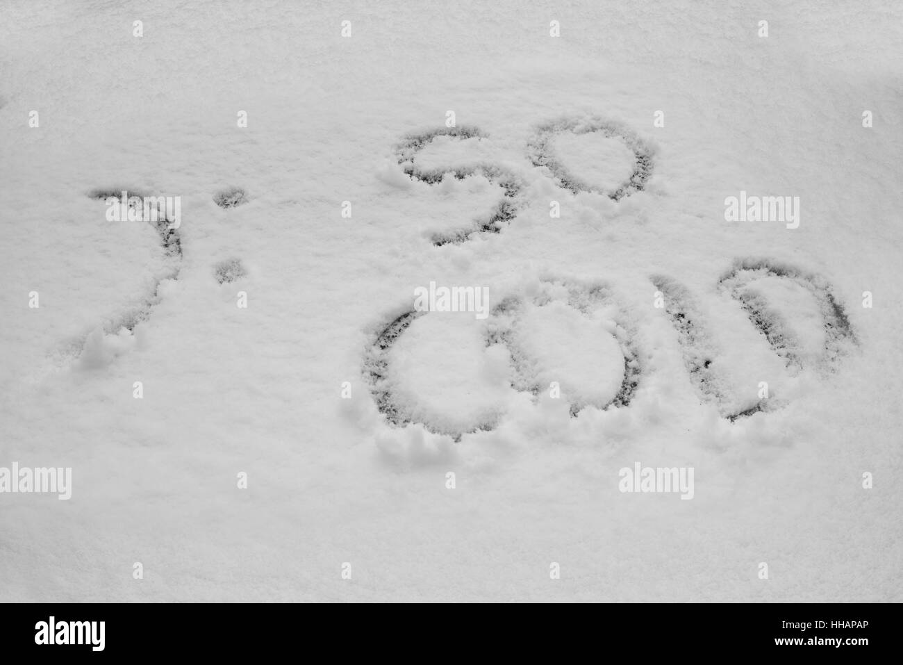 Word so cold written in snow Stock Photo - Alamy