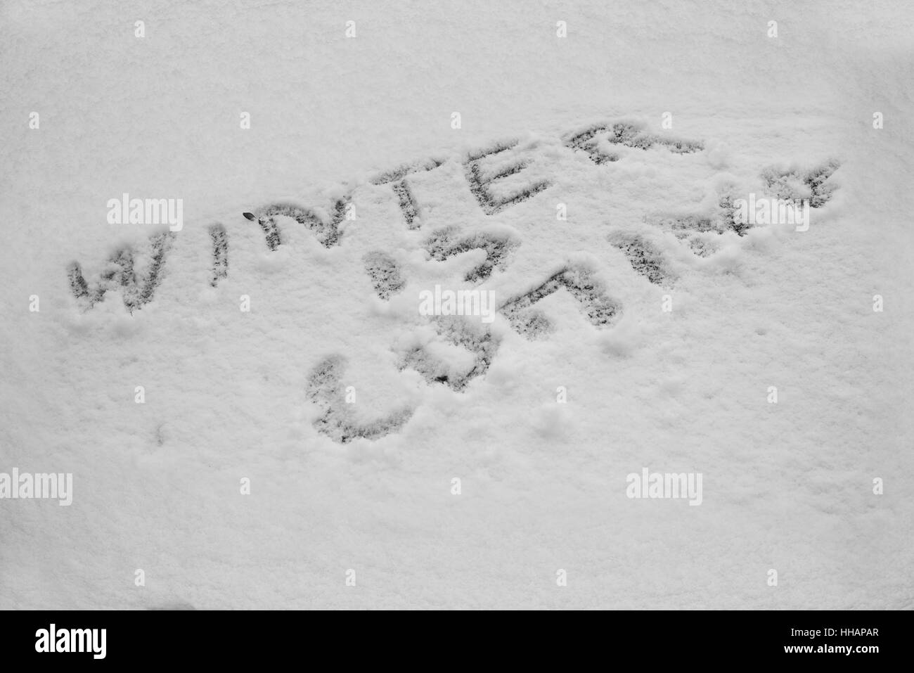 Word winter is coming cold written in snow Stock Photo - Alamy