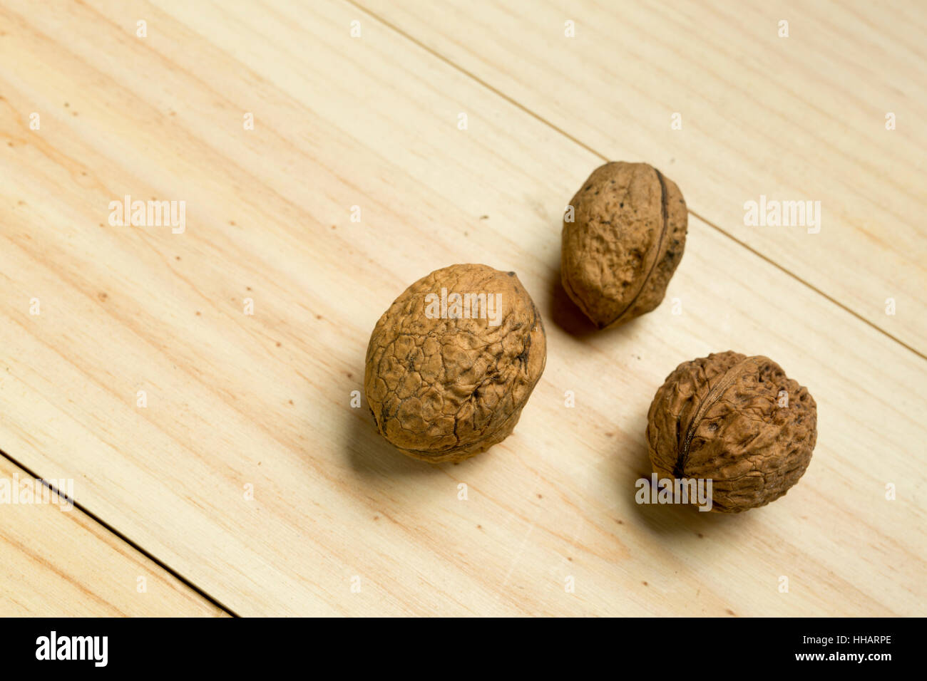 Nuts on a pine wood background. Artificial lighting with flax Stock ...