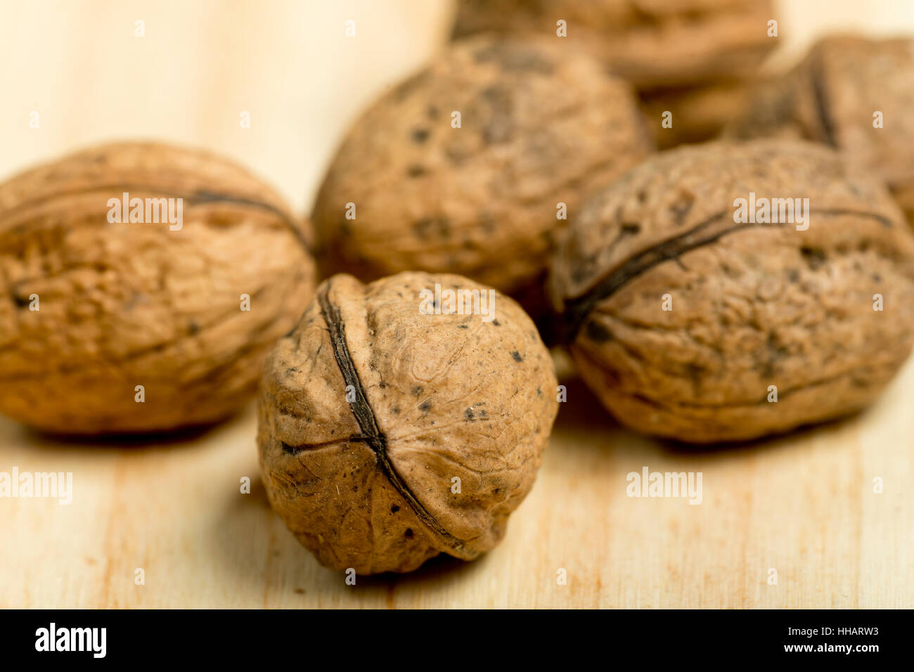 Nuts on a pine wood background. Artificial lighting with flax Stock ...