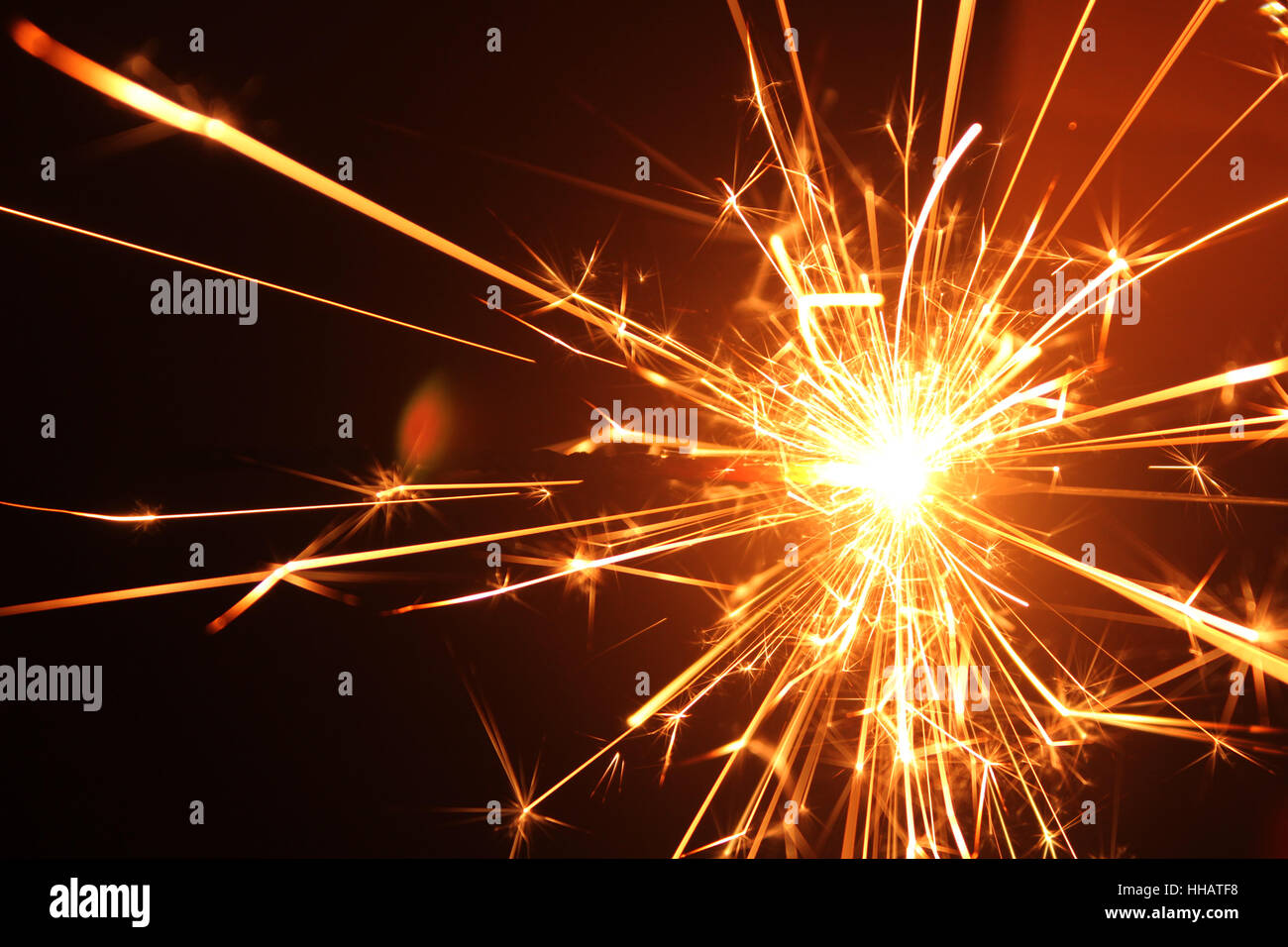 a burning sparkler on black Stock Photo - Alamy