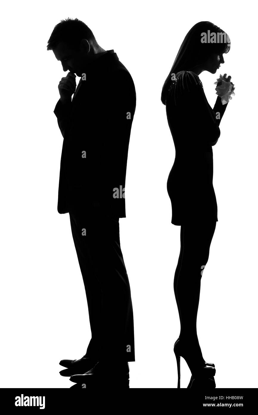 one caucasian sad couple back to back man thinking and woman crying ...