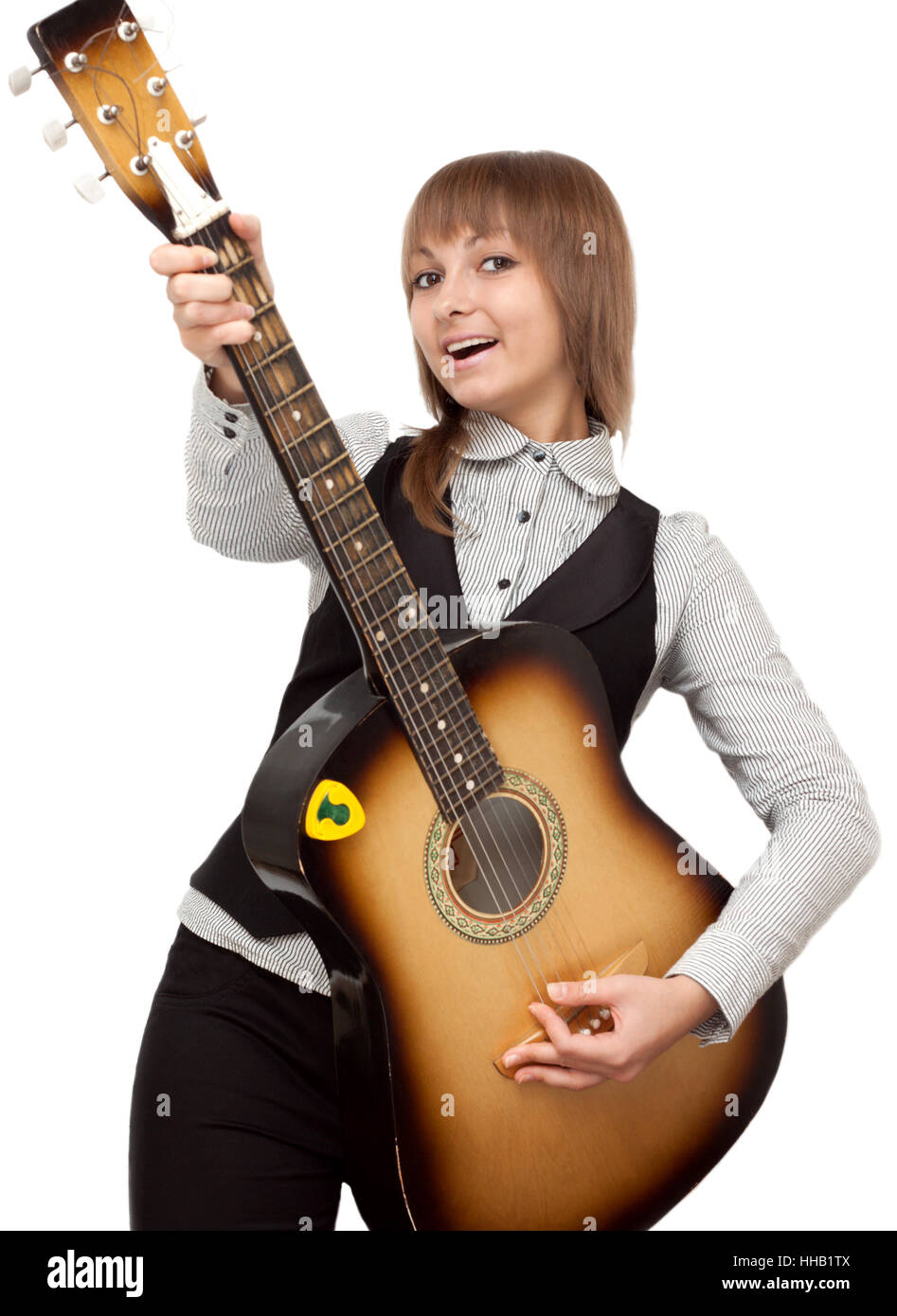 Young girl with guitar sings on white background Stock Photo - Alamy