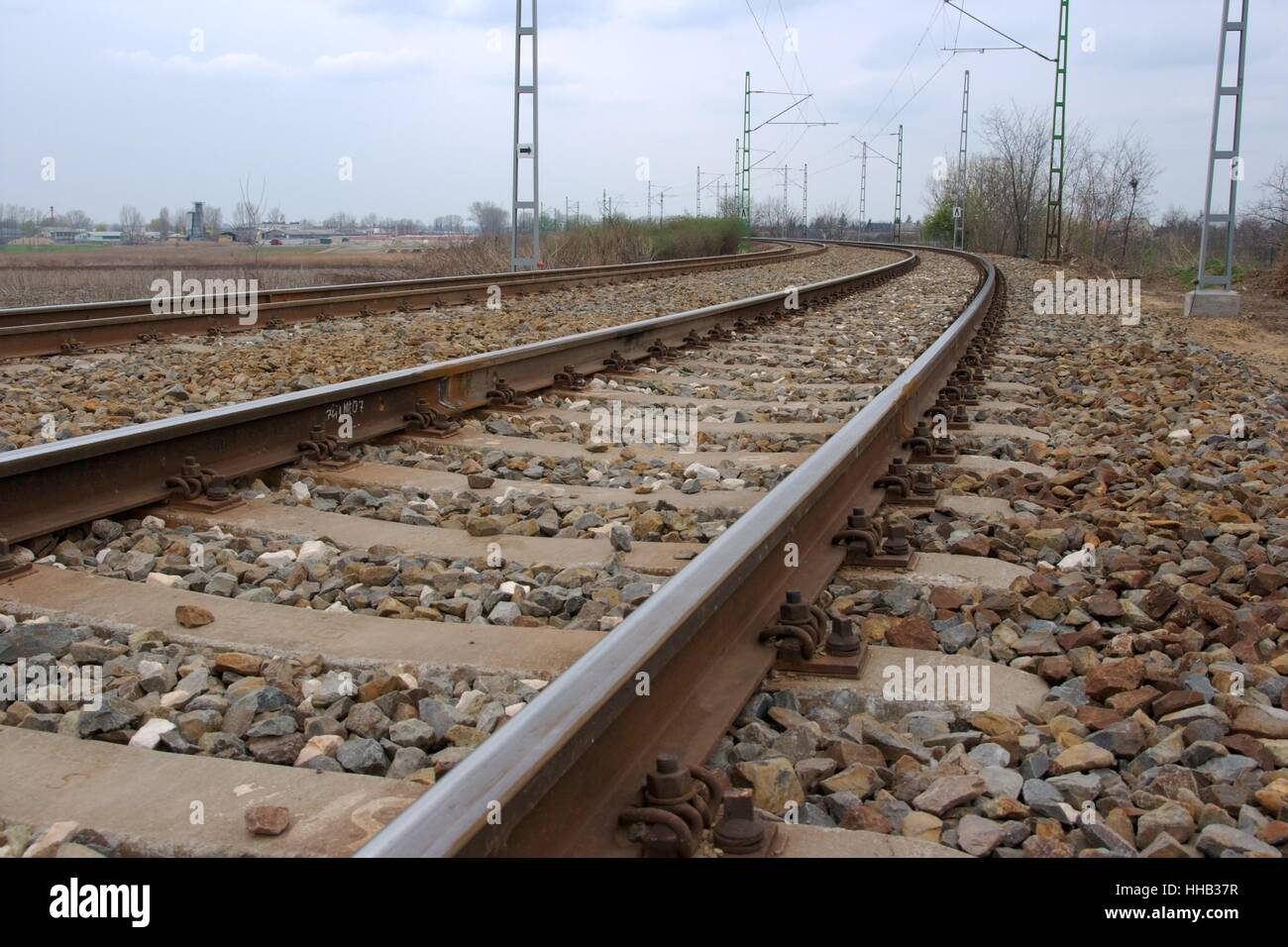 Two pairs of railway tracks in a bend Stock Photo - Alamy