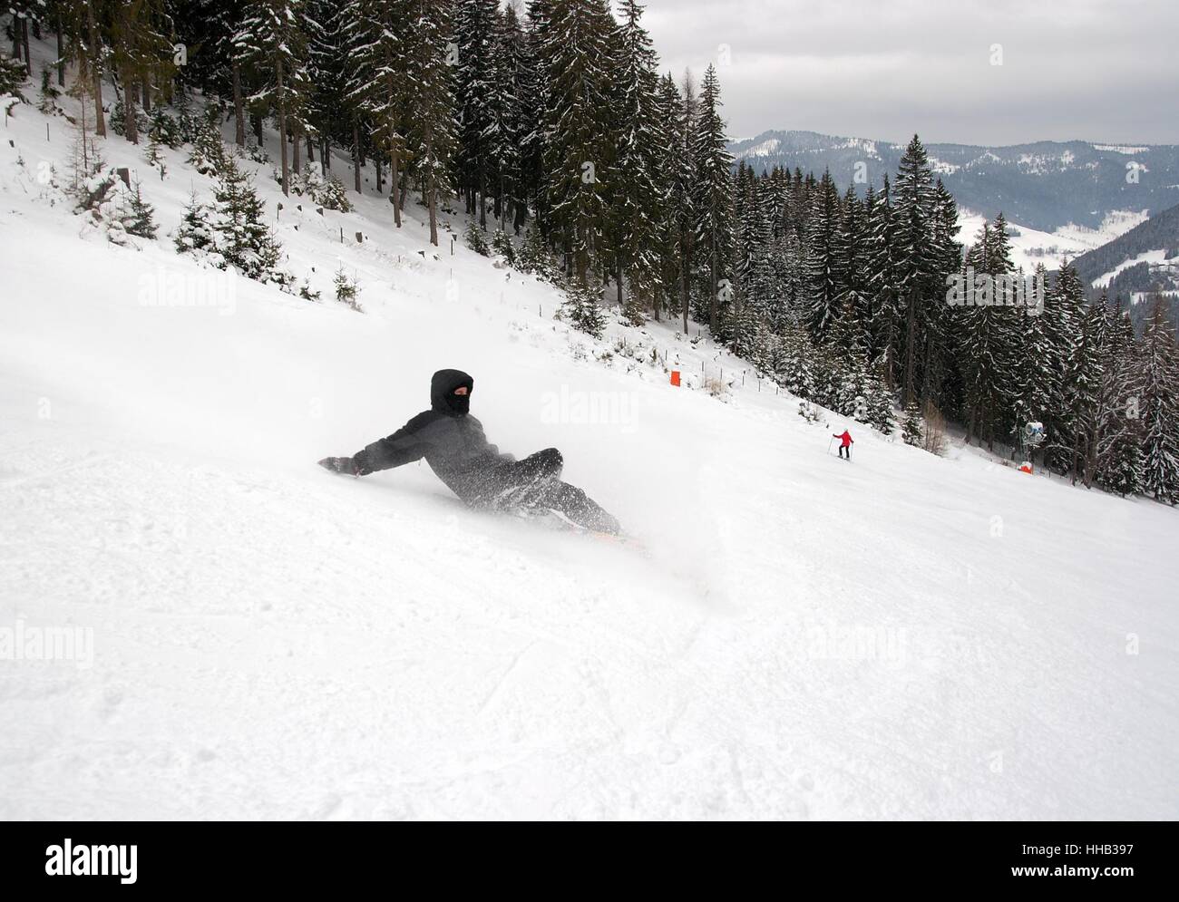 Skier falling over on the track Stock Photo - Alamy