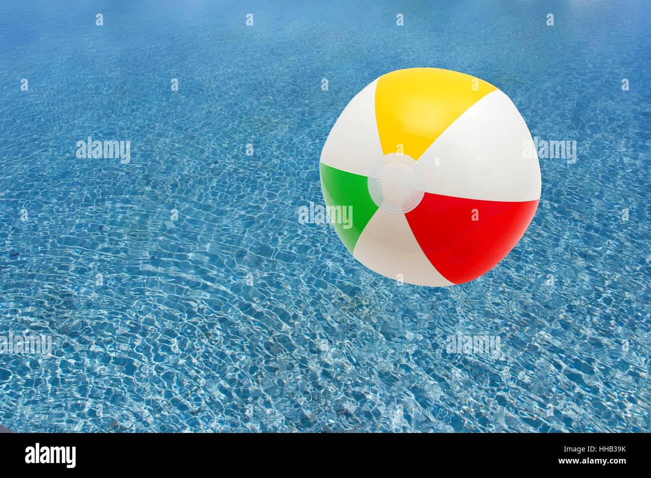 Plastic ball over water surface Stock Photo - Alamy