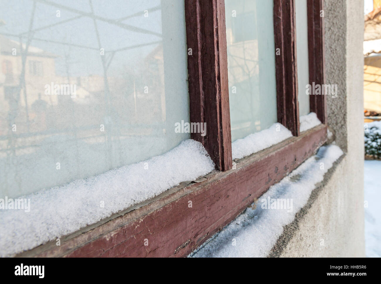 A view of brown old snow covered window Stock Photo - Alamy