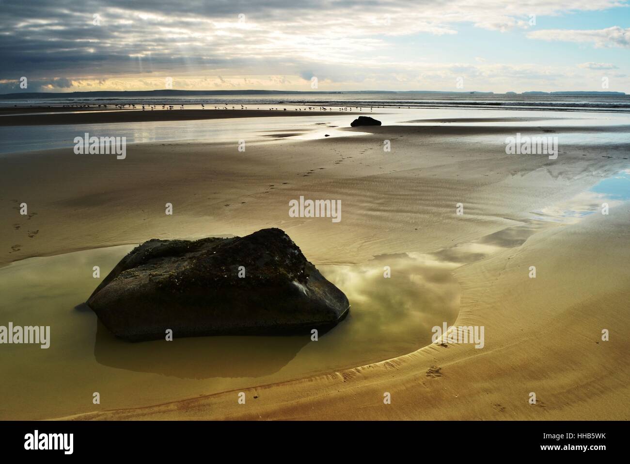 Newgale beach with rock pool, sand and a spectacular sky Stock Photo ...