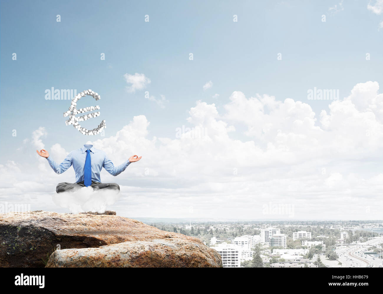 Headless meditating businessman Stock Photo - Alamy