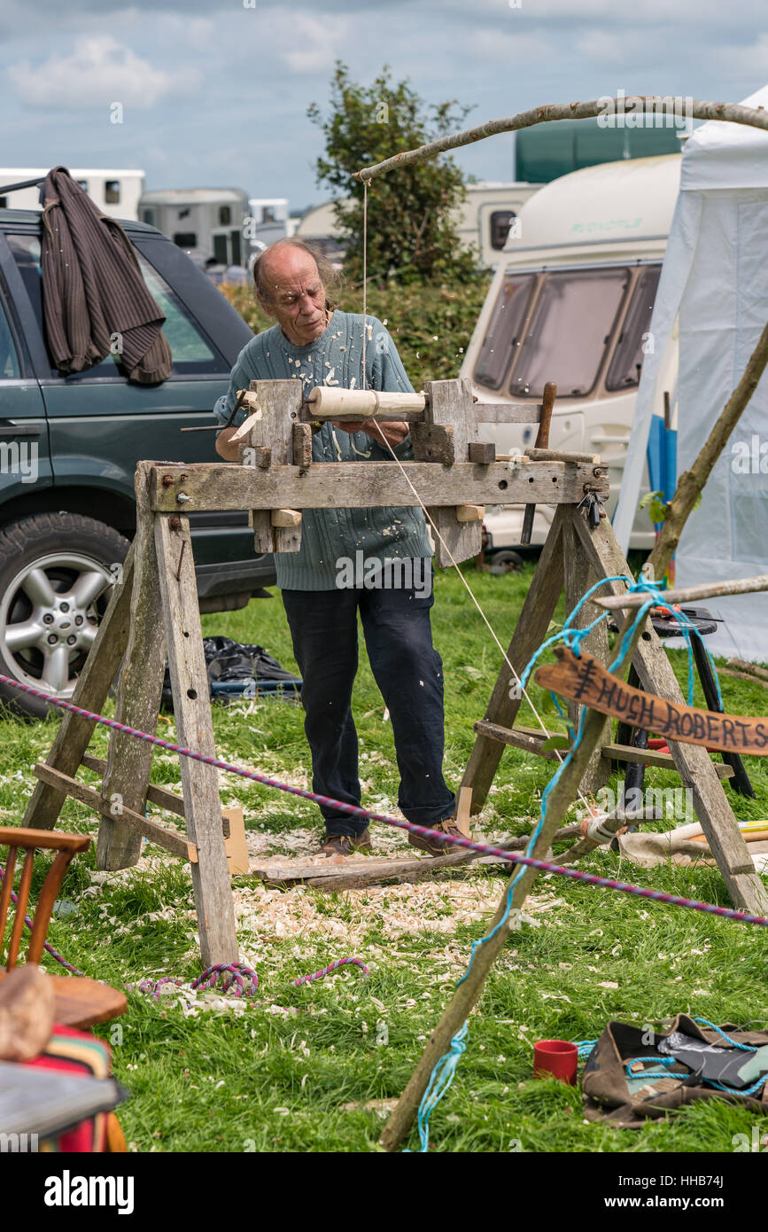 Craftsman using traditional foot powered lathe at Anglesey Show Stock ...