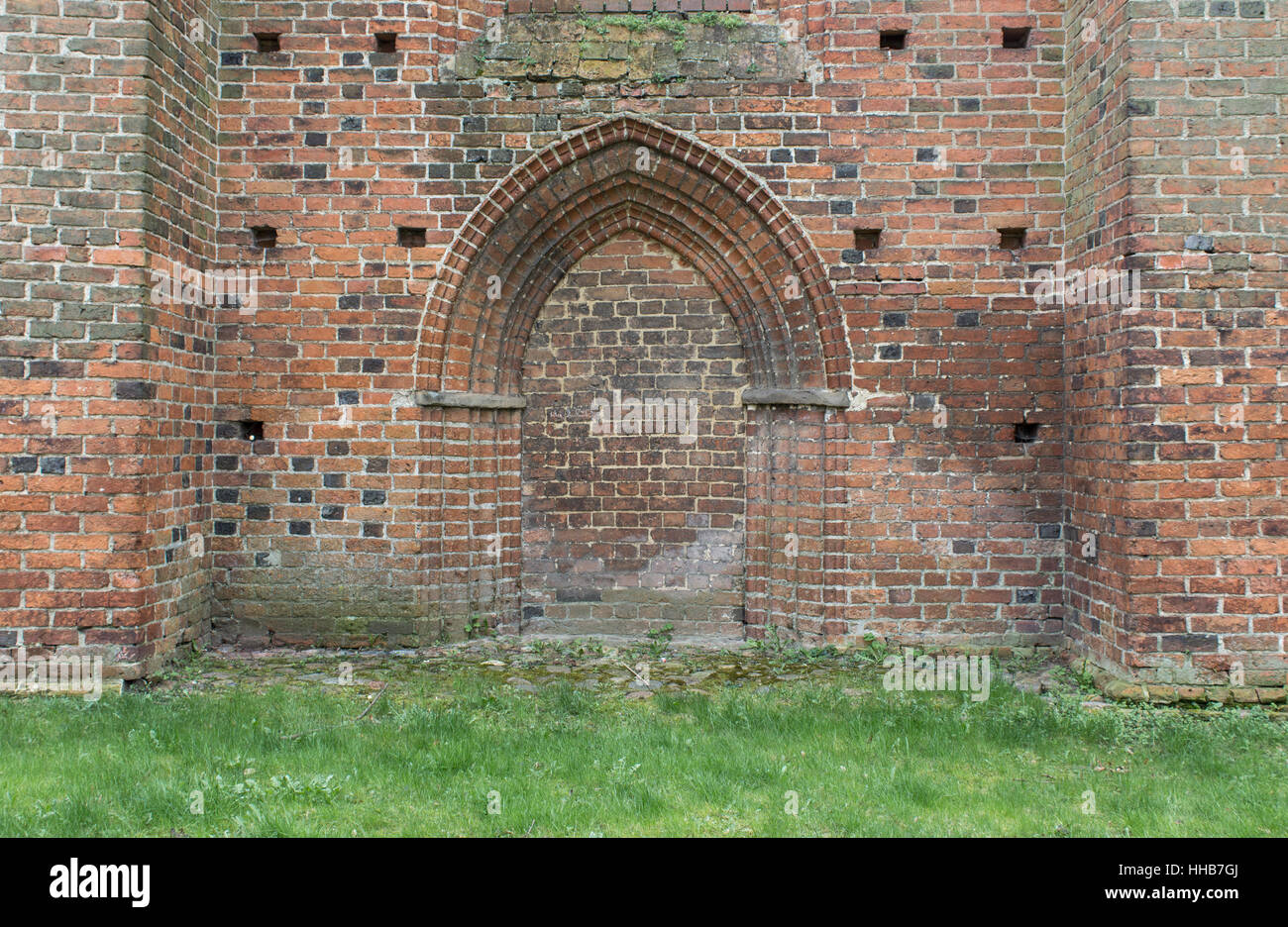 Wall with gothic pointed arch Stock Photo - Alamy