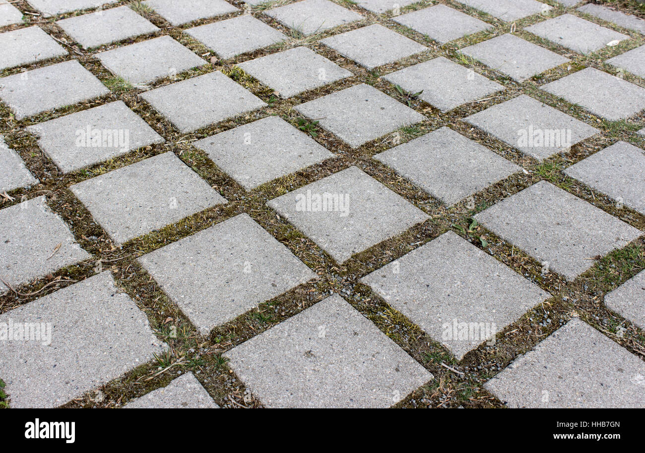 Surface with gray, square paving stones Stock Photo - Alamy