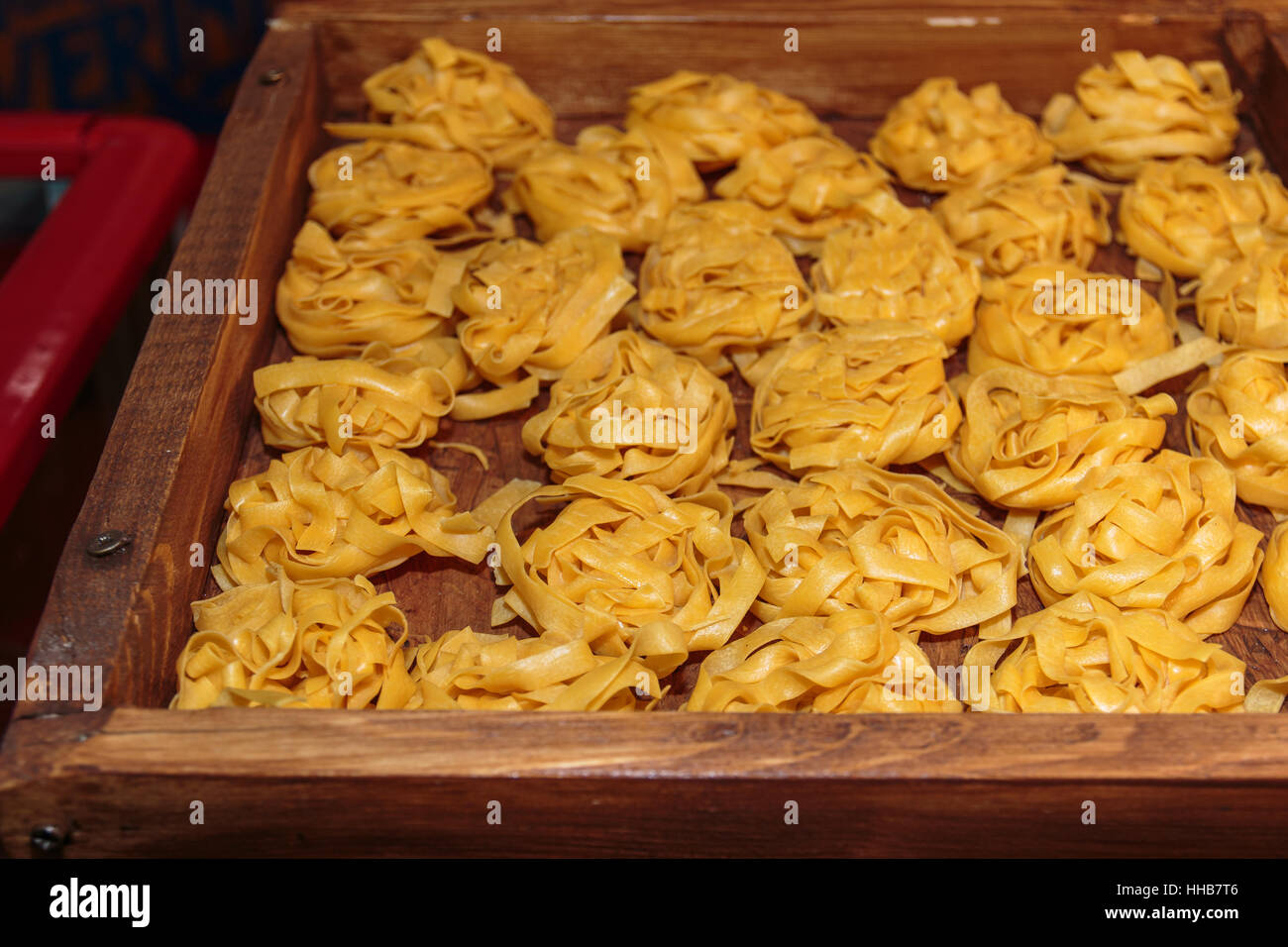 Uncooked Tagliatelle Italian Pasta in Wooden Compartmented Box Stock ...
