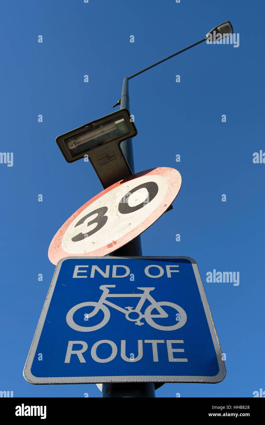 british end of cycle route road sign beneath a 30mph speed limit sign ...