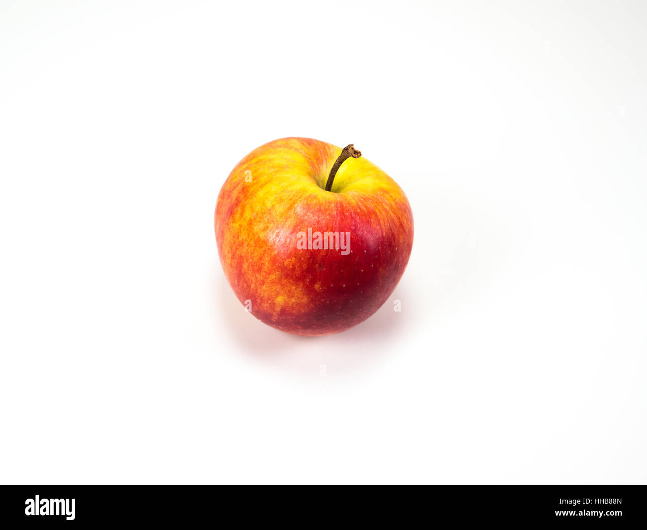 A red single British apple on a plain white studio background Stock ...